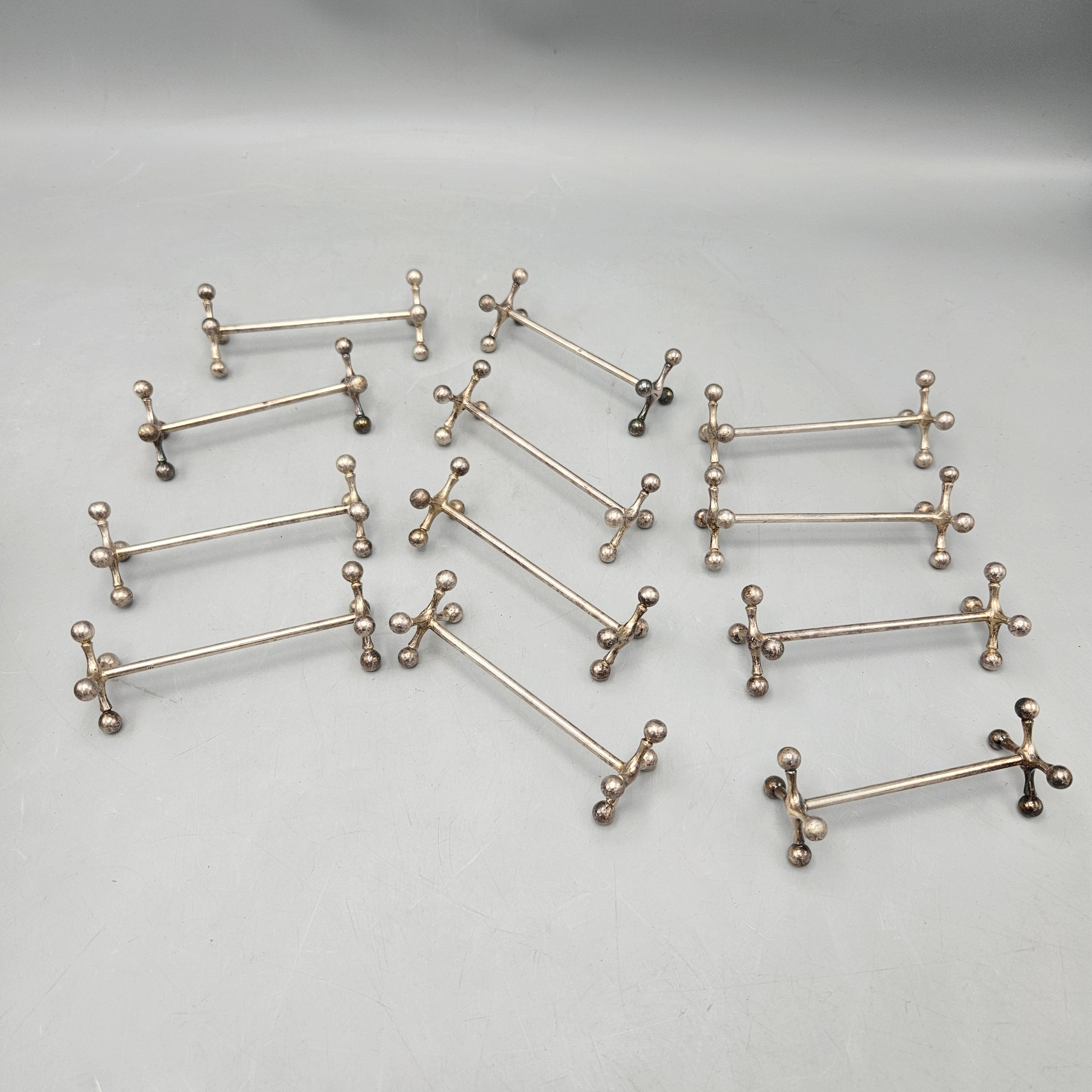 Set of 12 Vintage Silver Jacks Form Knife Rests